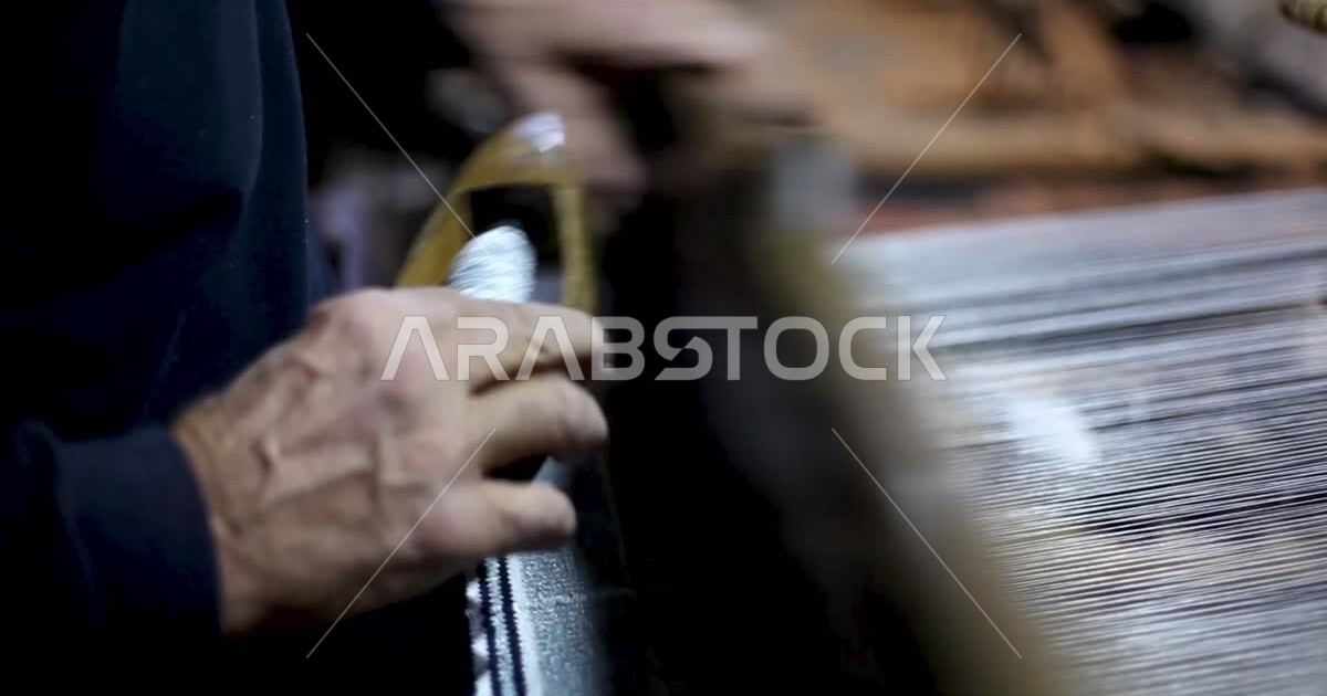 Traditional folk works and industries, a close-up of the hands of a ...