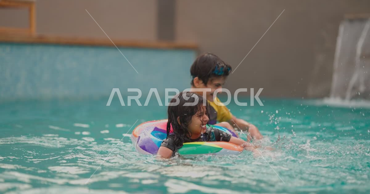 Enjoying the summer vacation with the family, swimming in the water ...