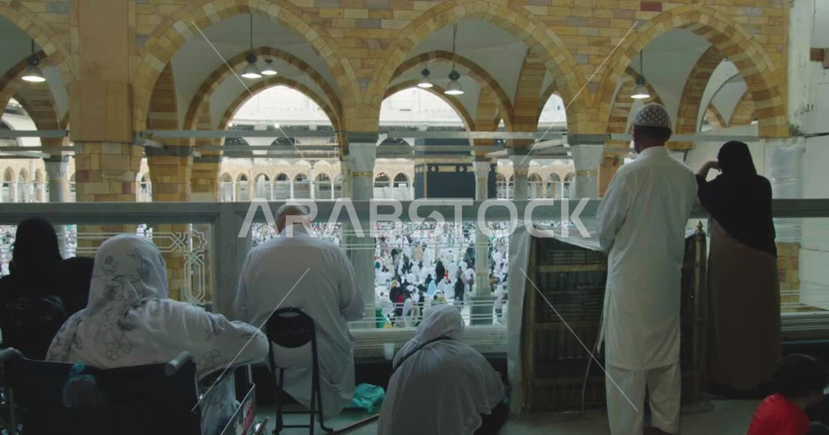 Muslims circumambulating around the Holy Kaaba in Mecca, a close-up of ...