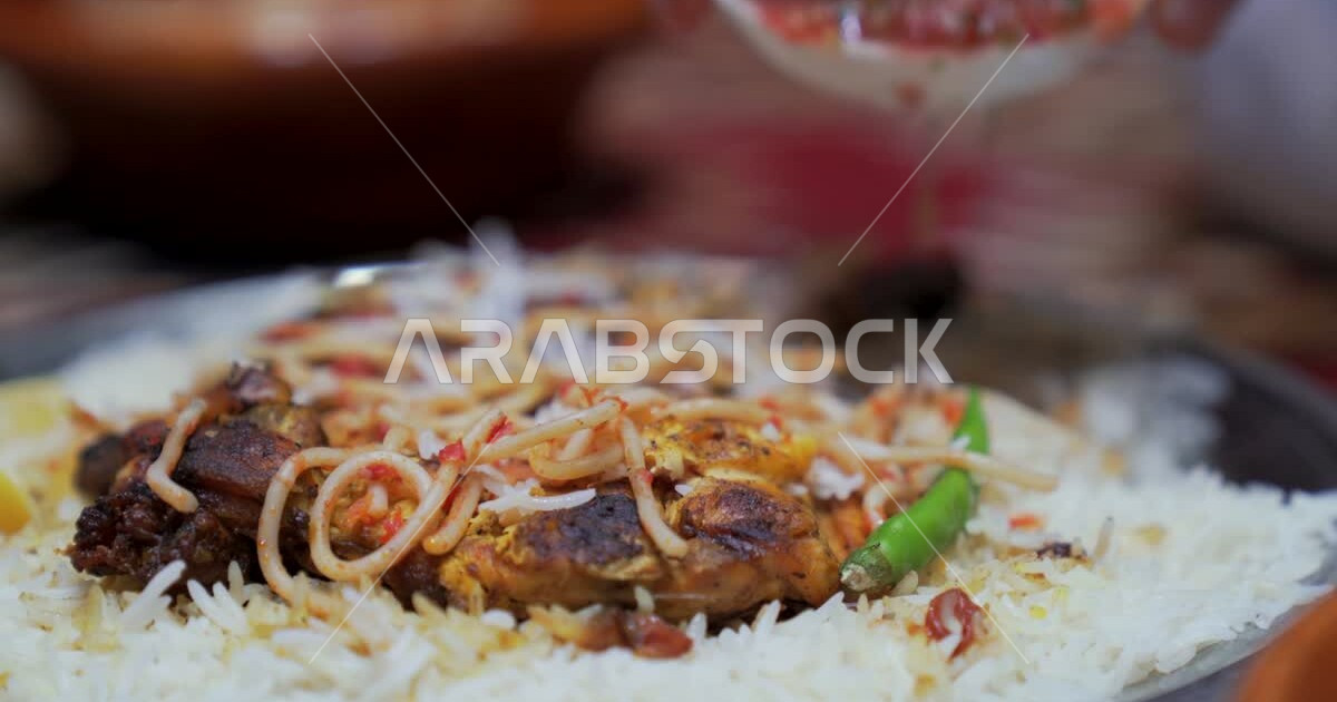 Two young Saudi Arabian Gulf men gathered at the dining table, Ramadan ...