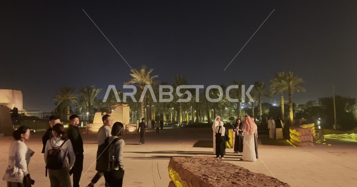 Green palm trees in the heritage Salwa Palace in Saudi Arabia, visitors ...