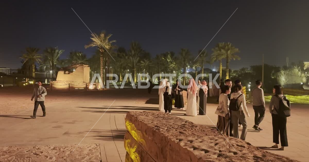 Green palm trees in the heritage Salwa Palace in Saudi Arabia, visitors ...