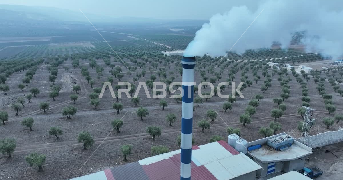 Smoke rising from one of the factories and laboratories and urban air ...