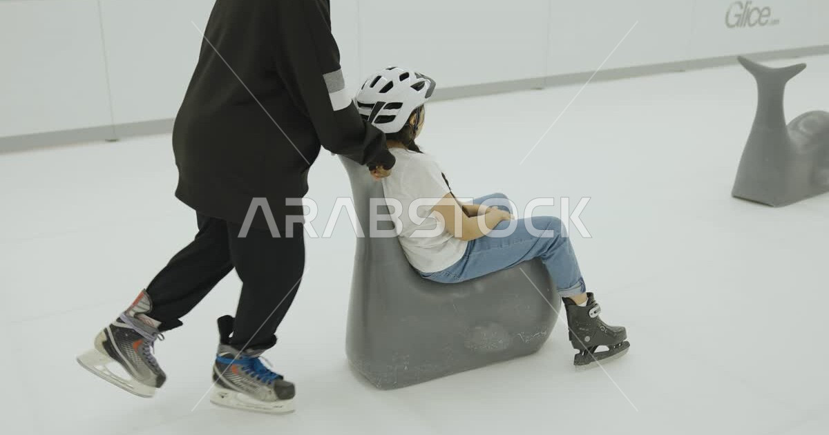 Playing on the ice skating rinks in the entertainment malls in Saudi ...