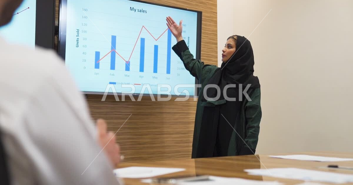 A Saudi businesswoman in an administrative meeting with a group of ...