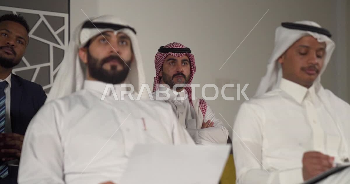 Saudi trainees in a training course, businessmen and a businesswoman in ...
