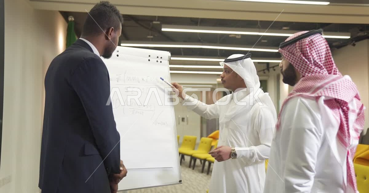A Saudi businessman explains the company's strategies to his colleagues ...