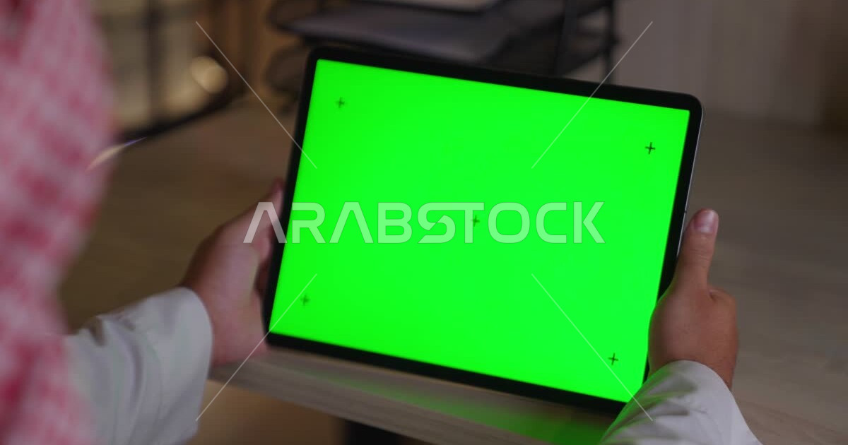 Displaying a blank green screen, working with modern technology and ...