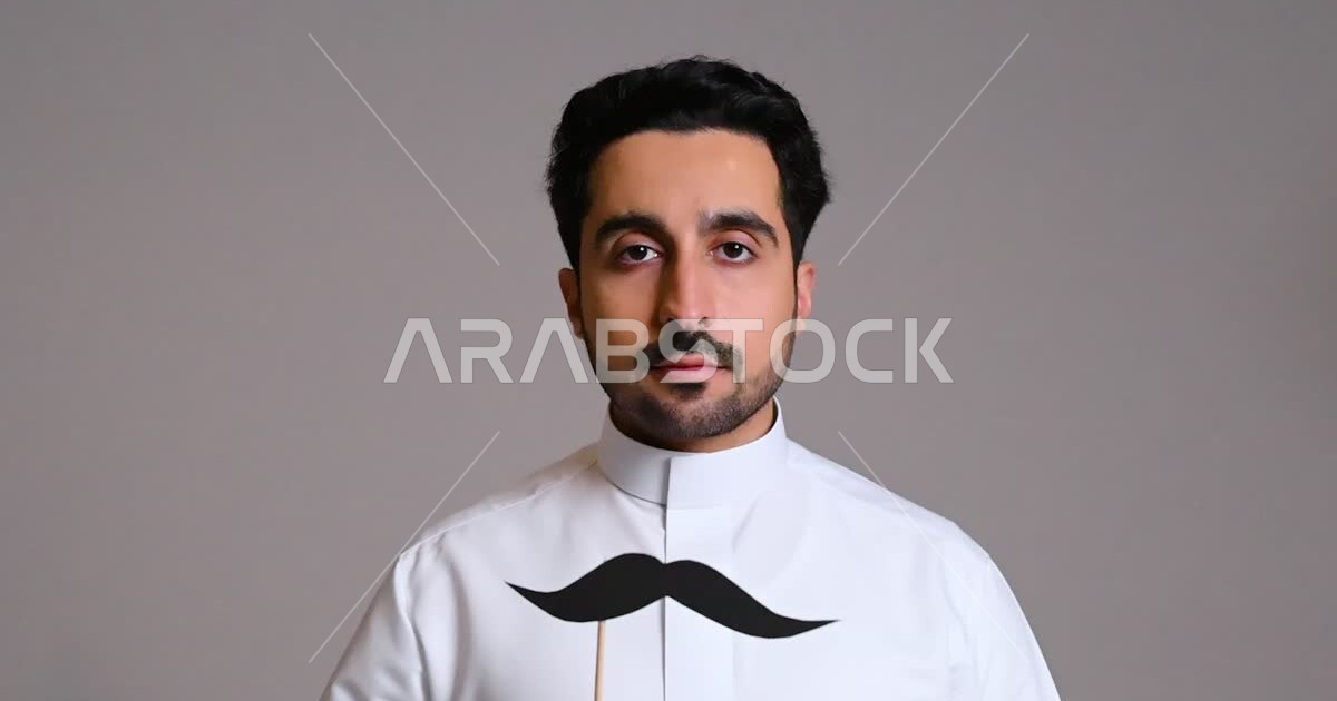 Celebrating International Men’s Day, a close-up portrait of a Saudi ...