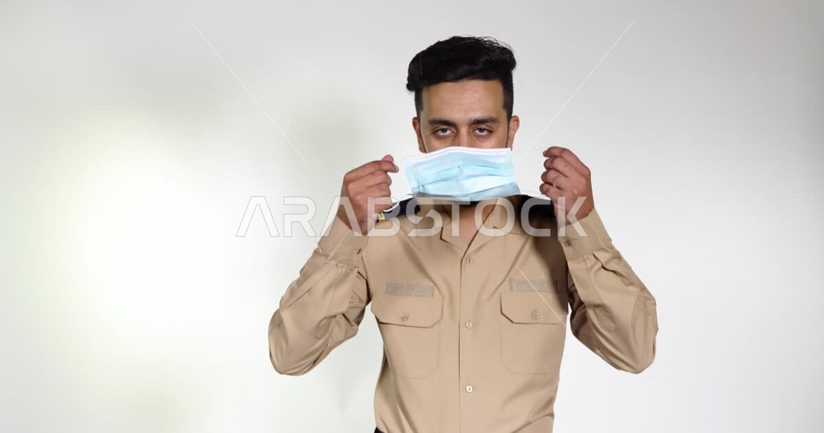 Portrait of a Saudi Arabian Gulf man working as a security man, wearing ...