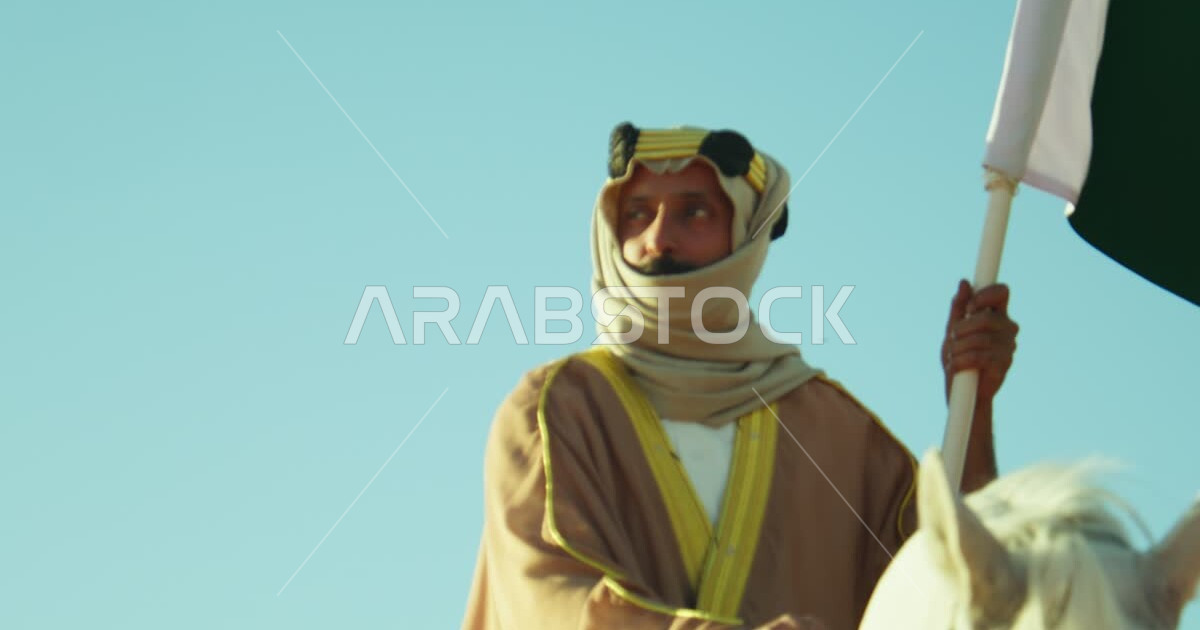 Raising the Saudi flag with respect and pride on National Day on ...