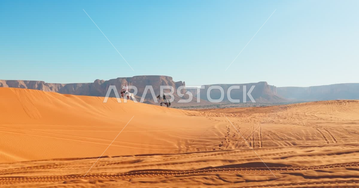 Mountainous terrain and soft golden sand in the desert areas of the ...