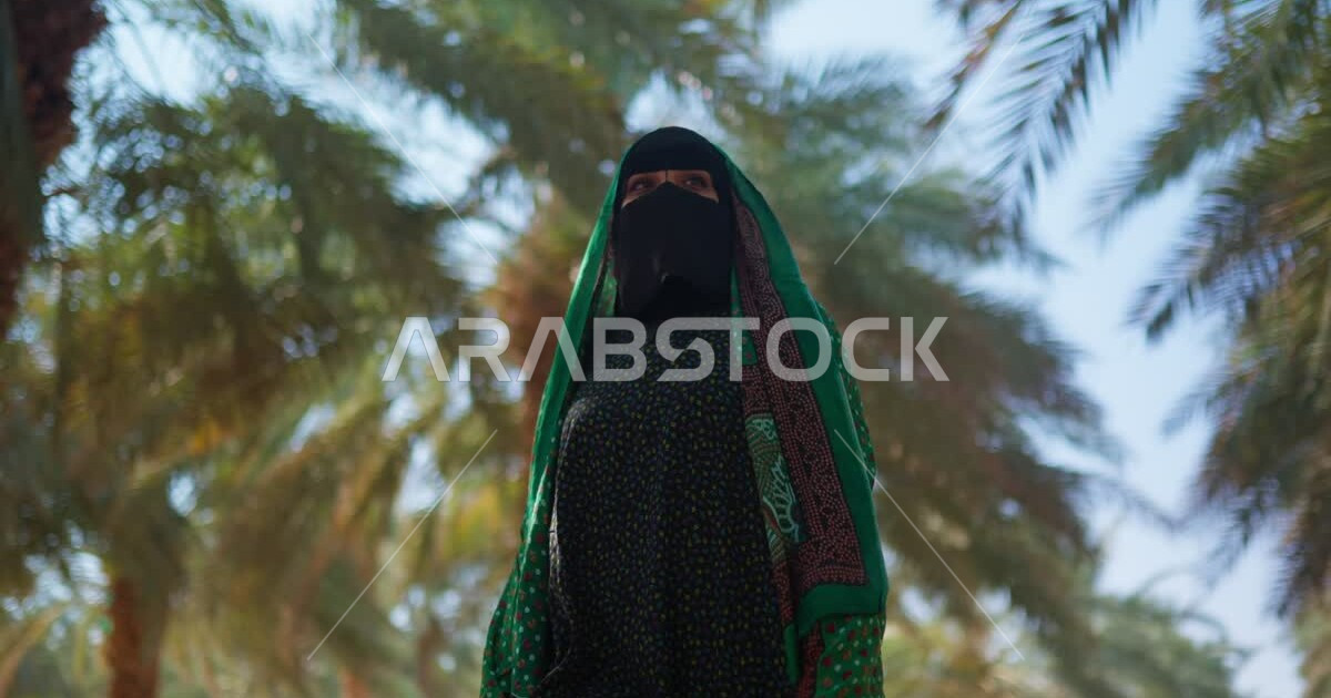 Enjoying the green landscape, slow-motion photography of a veiled Saudi ...