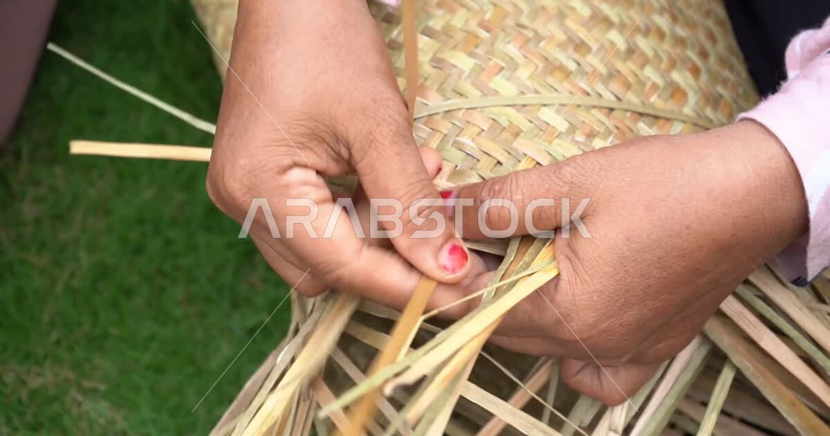 The use of dried palm leaves in making baskets, traditional folk women ...