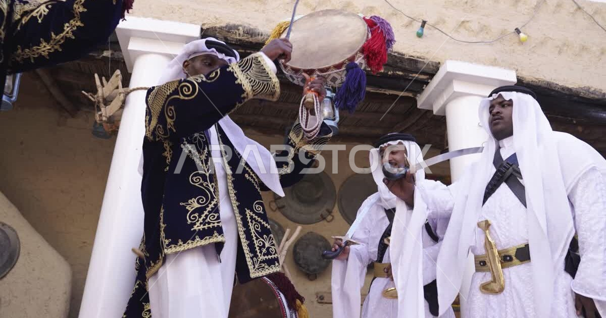 Folk dancing, chants, and drumming on national occasions, a Saudi Najdi ...