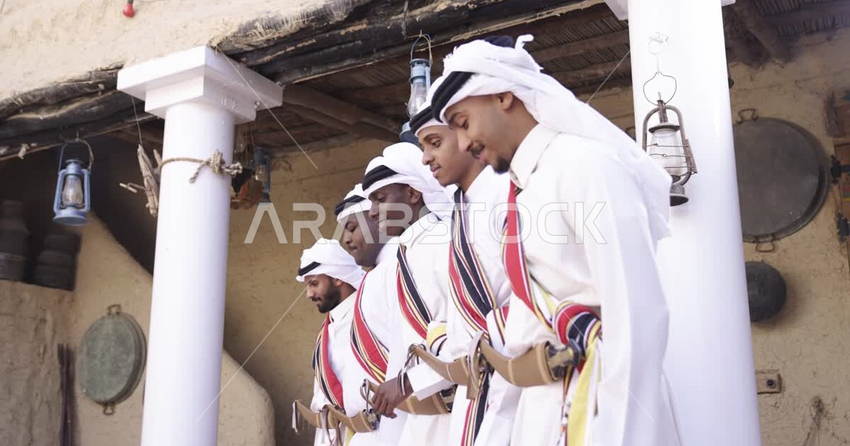 Wearing the popular Najdi Ardha costumes, a group of Saudi Gulf Arab ...
