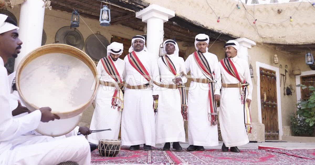 Al-Ardha Al-Najdi band wearing traditional costume performs folk dance ...