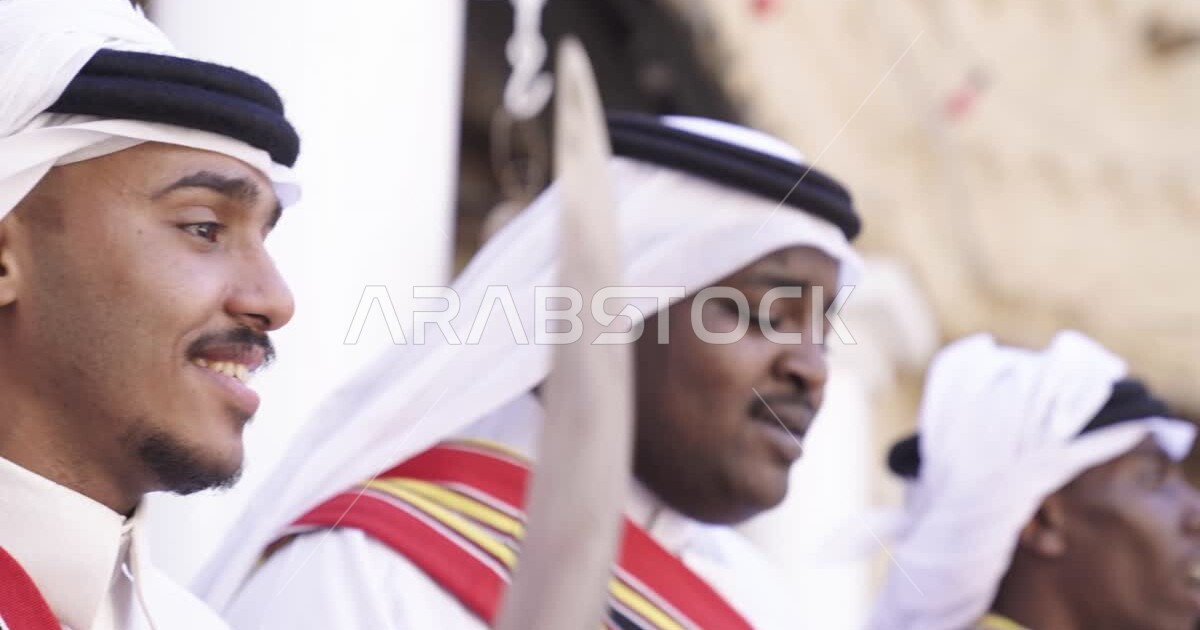 Al-Ardha Al-Najdi band, wearing traditional costume, performs a folk ...