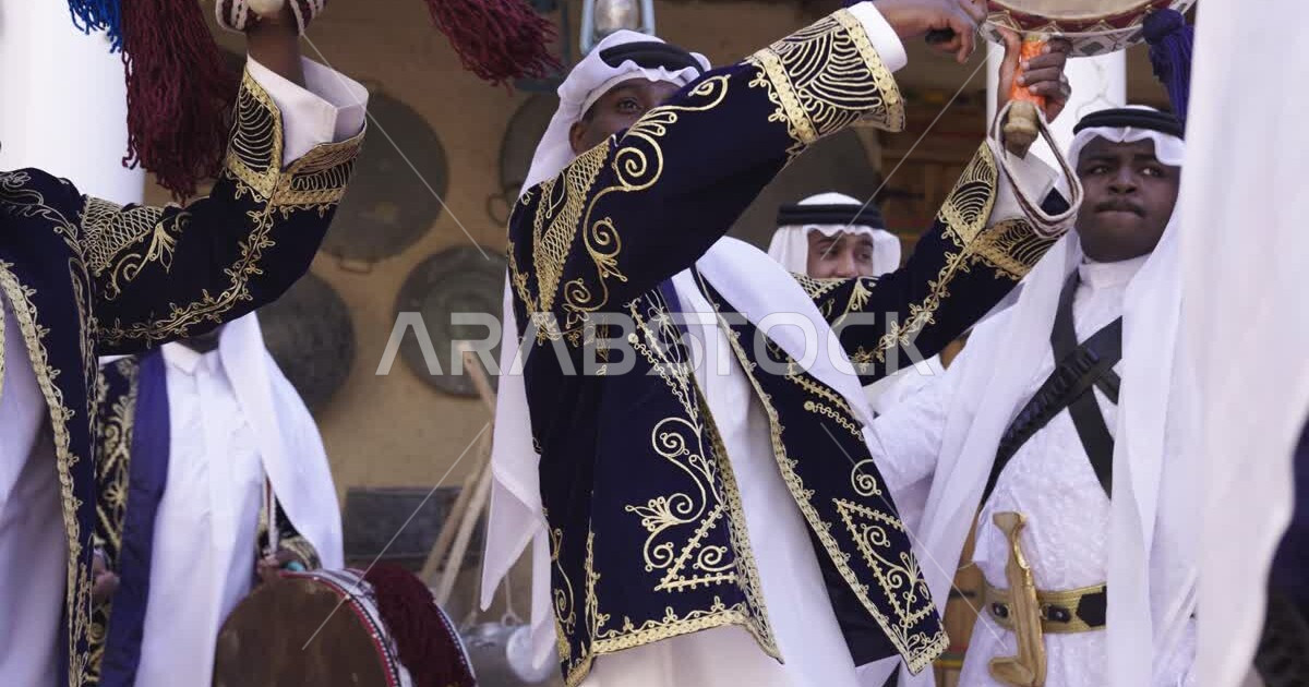 A group of Saudi Gulf Arab men celebrate the anniversary of the ...