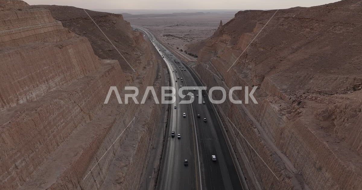 Drone photography of the highway in the middle of the desert, mountain ...