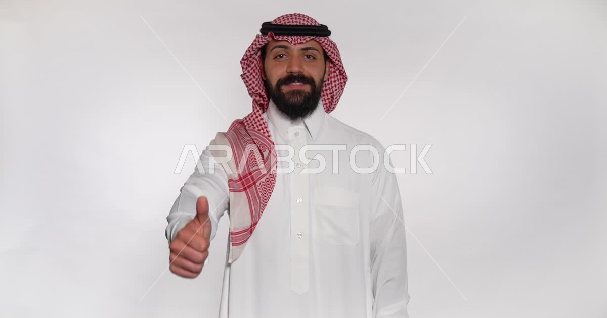 Portrait of a Saudi Gulf man in traditional Saudi dress, with different ...