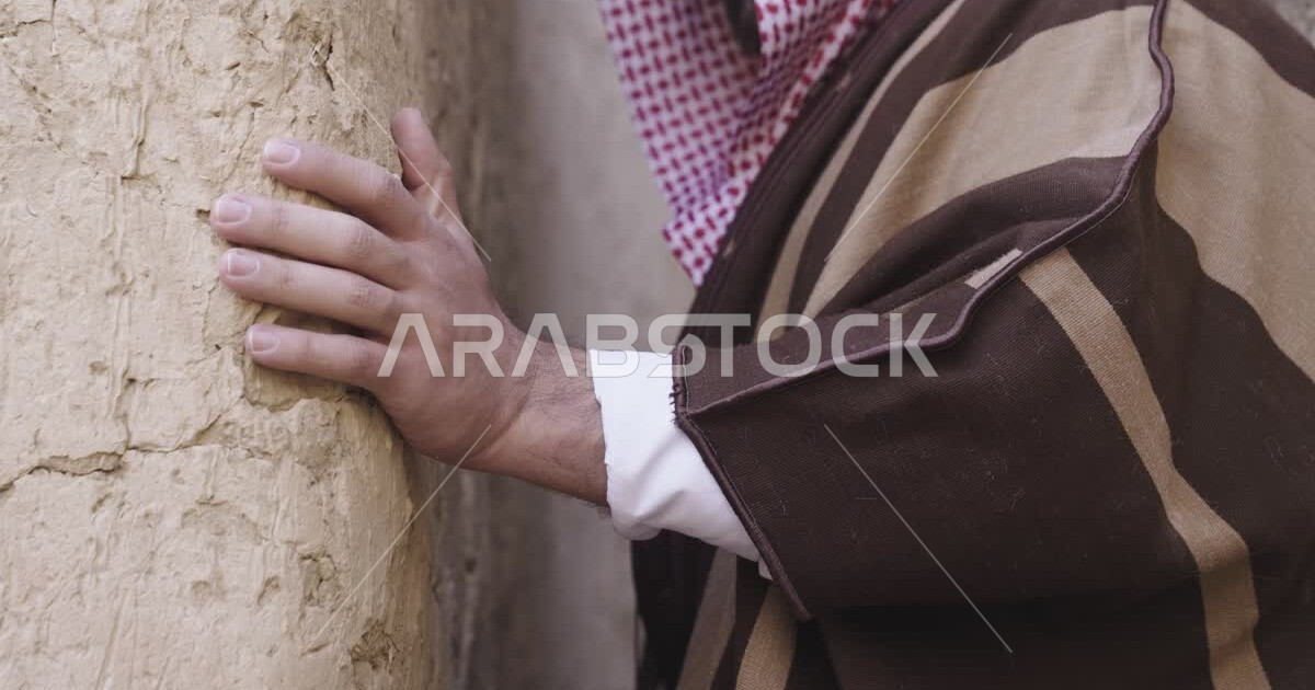 Our Day 172 AD, a close-up of a Saudi Gulf Arab man wearing a robe and ...