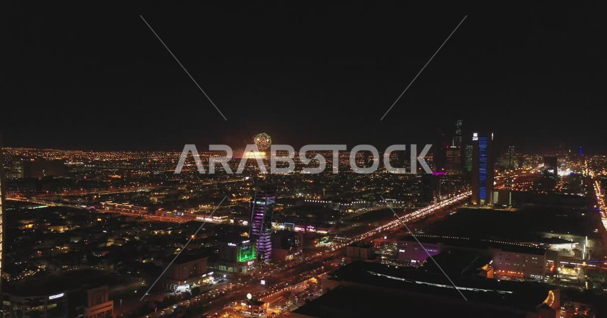 Towers and skyscrapers illuminated at night, celebrations with ...