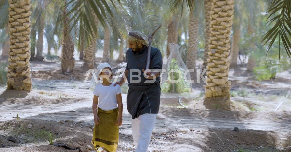 A farmer carrying agricultural tools and walking around the farm with ...