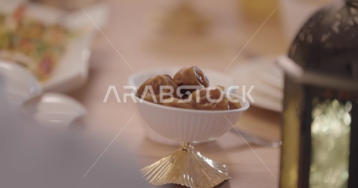 Breaking the fast by eating healthy dates, a close-up of a tamriyah on ...