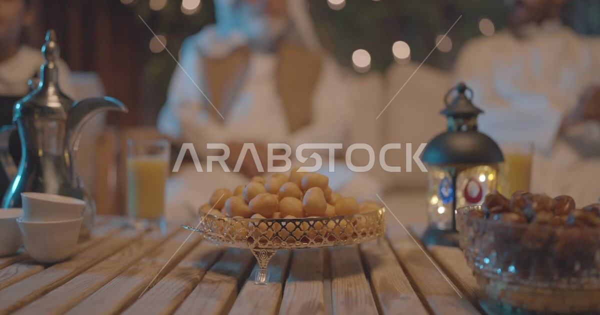 Popular Arabic sweets, a Saudi Arabian Gulf girl offering a solution of ...