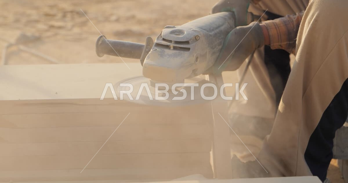 A close-up photo of the hand of a skilled Saudi Gulf Arab craftsman in ...