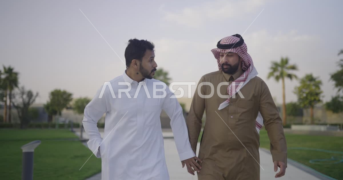 Taking souvenir selfies, a close-up of two Saudi Gulf Arab friends ...