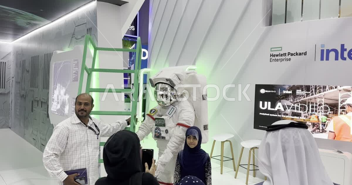 Taking souvenir photos in front of smart robots at the LEAP Technology ...