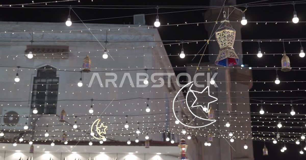 Lighting ropes in the shape of a crescent and stars hanging in the Al ...