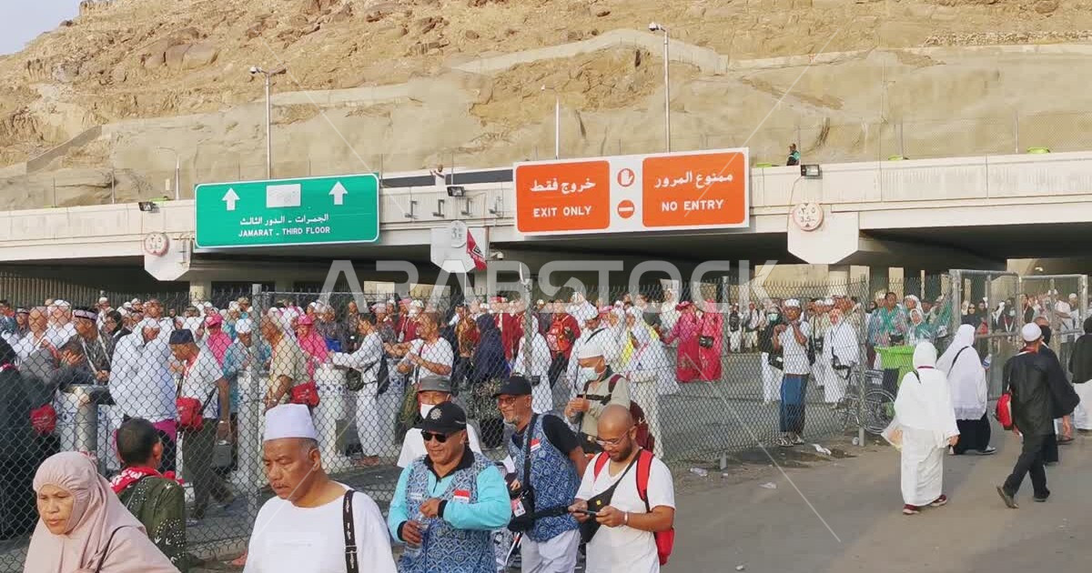 Guidance signs on the roads and streets of Mecca, Muslims leaving the ...