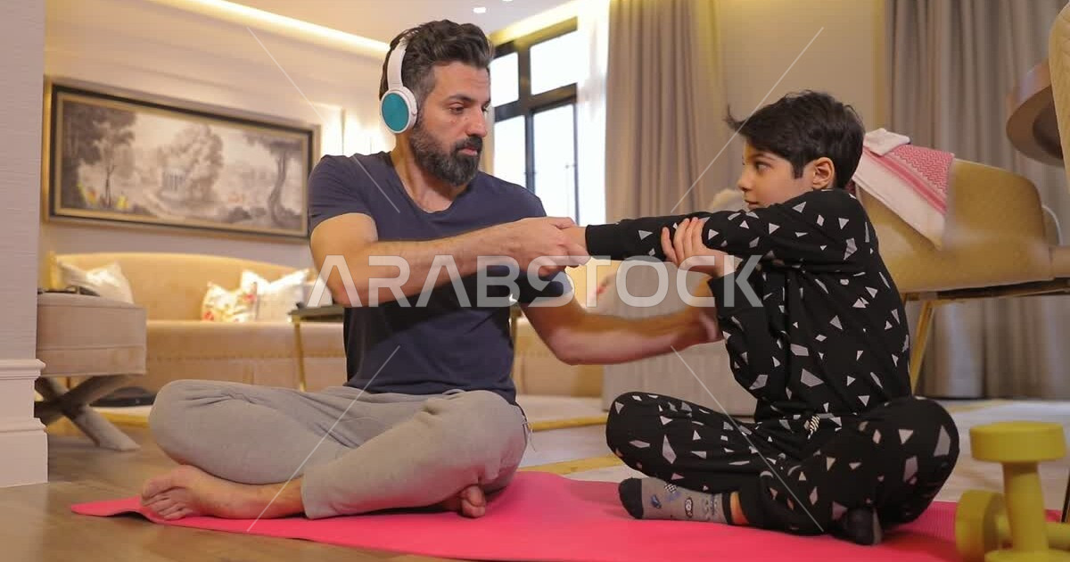 A Saudi Arabian Gulf man practices morning sports at home with the ...