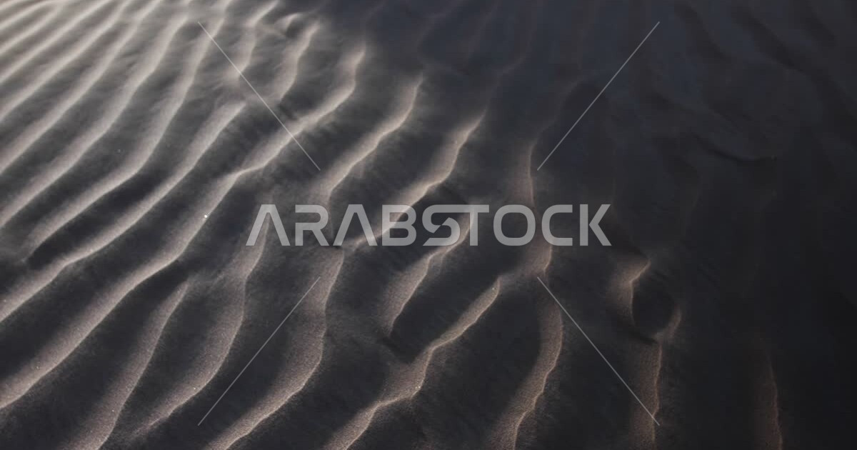 Storm over the soft golden sand in Dubai, black and white aerial drone ...
