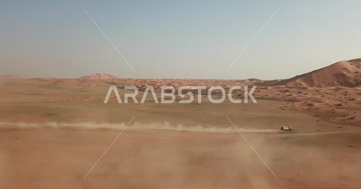 Sandy desert environment, drone photography of a racing car ...