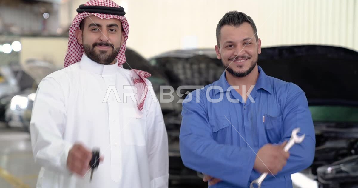 A Saudi Arab man stands with the mechanical engineer inside the auto ...