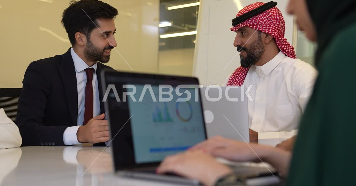 A business meeting between Saudi Gulf Arab employees in the meeting ...