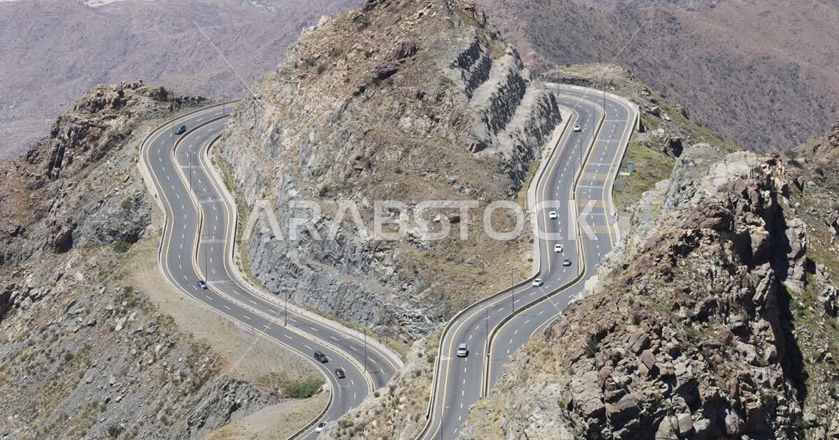 Aqabat Al Hada Road during the day, car traffic on paved roads and ...