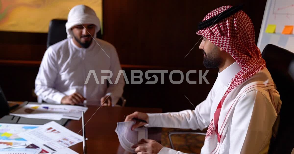Gulf businessmen, a Saudi man in a business meeting with an Emirati ...
