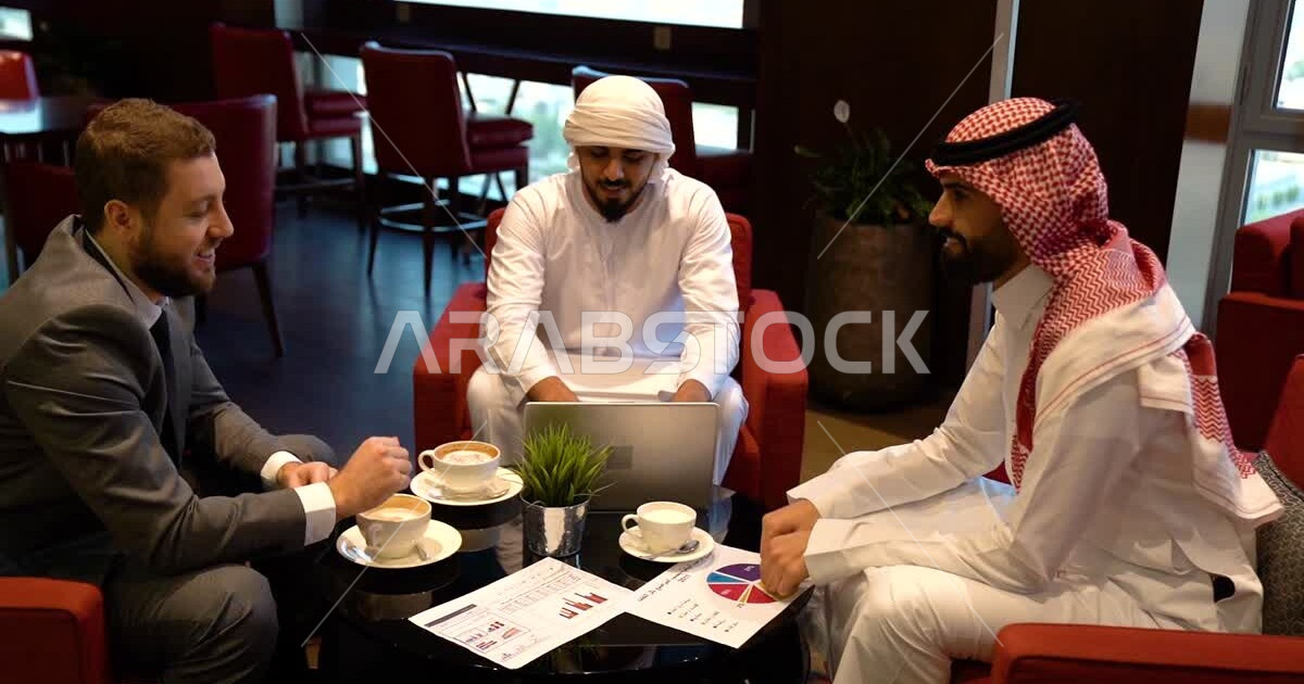 A business meeting that includes Gulf businessmen with the company’s ...