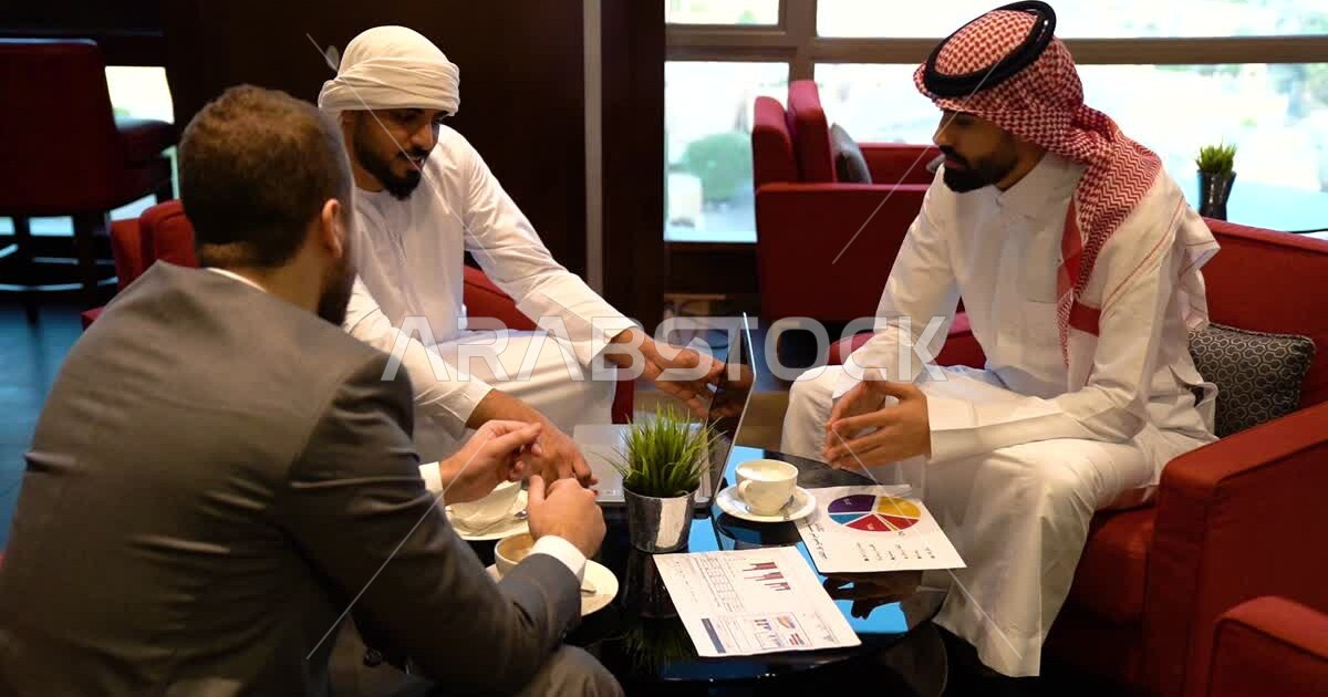 A business meeting that includes Gulf businessmen with the company’s ...