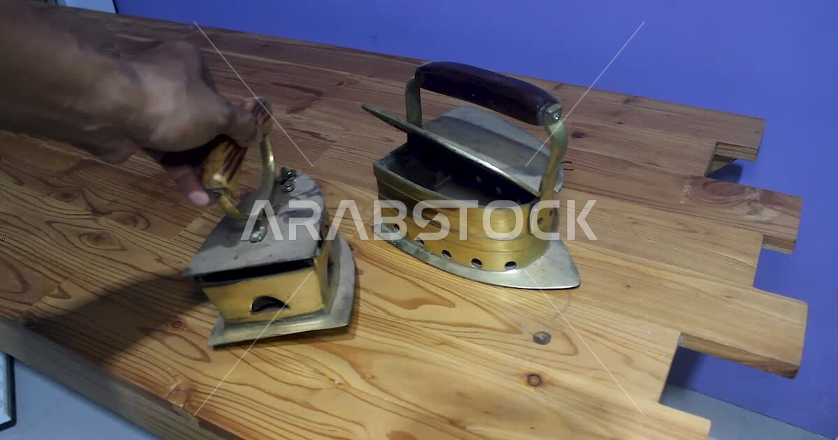 Old charcoal iron made of copper in traditional style, traditional ...