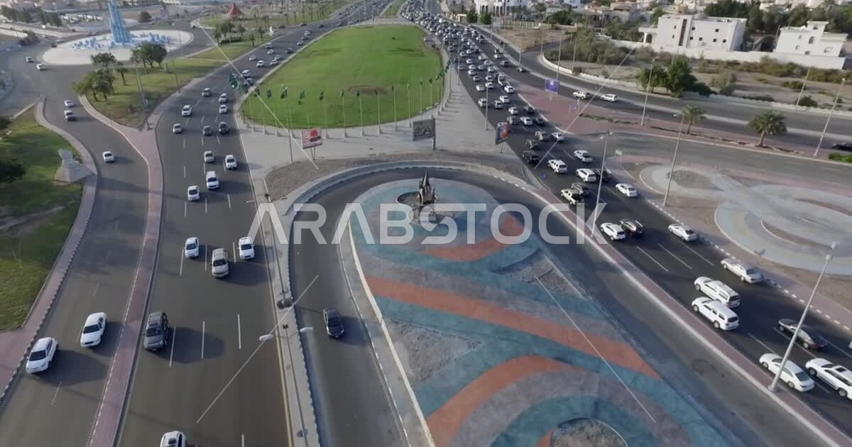 Traffic on paved streets during the day, drone footage of Jeddah main ...