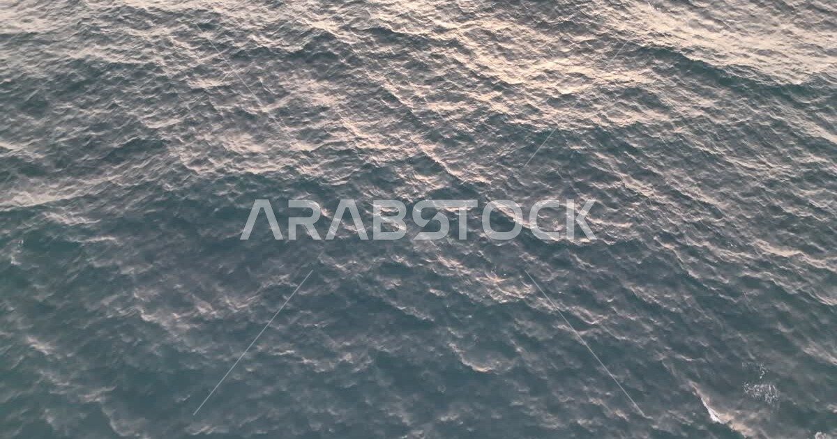 Drone photography of calm waves in the sea of Jeddah at sunset, famous ...