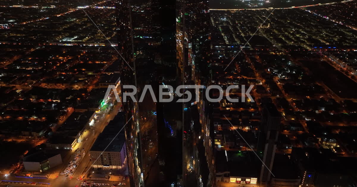 The illuminated Kingdom Tower in Riyadh at night, famous landmarks and ...