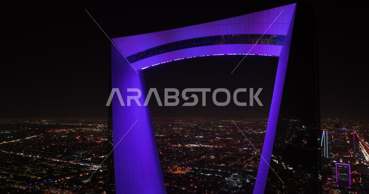 The illuminated Kingdom Tower in Riyadh at night, famous landmarks and ...