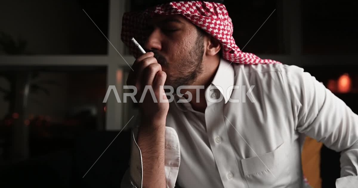 A young Saudi Arab smokes cigarettes, tobacco addiction, cigarette ...